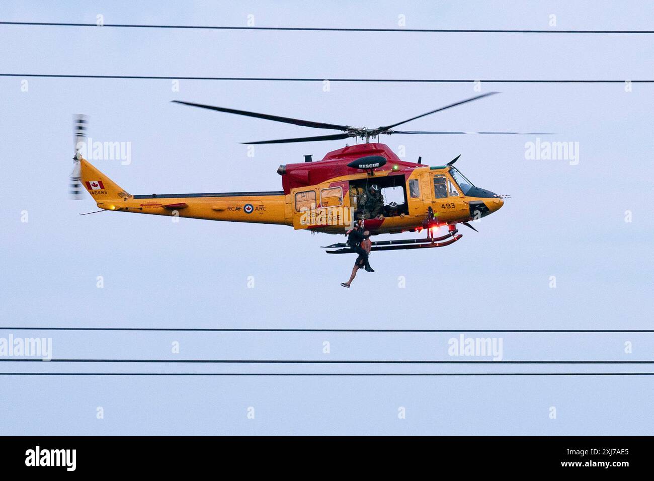 A Royal Canadian Air Force Search and Rescue helicopter crew rescues a ...