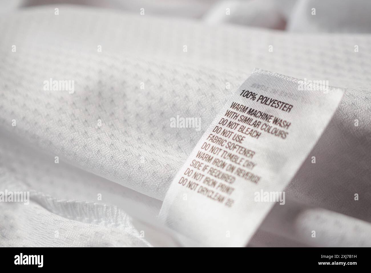 Polyester fabric Clothing label with laundry instructions Stock Photo ...