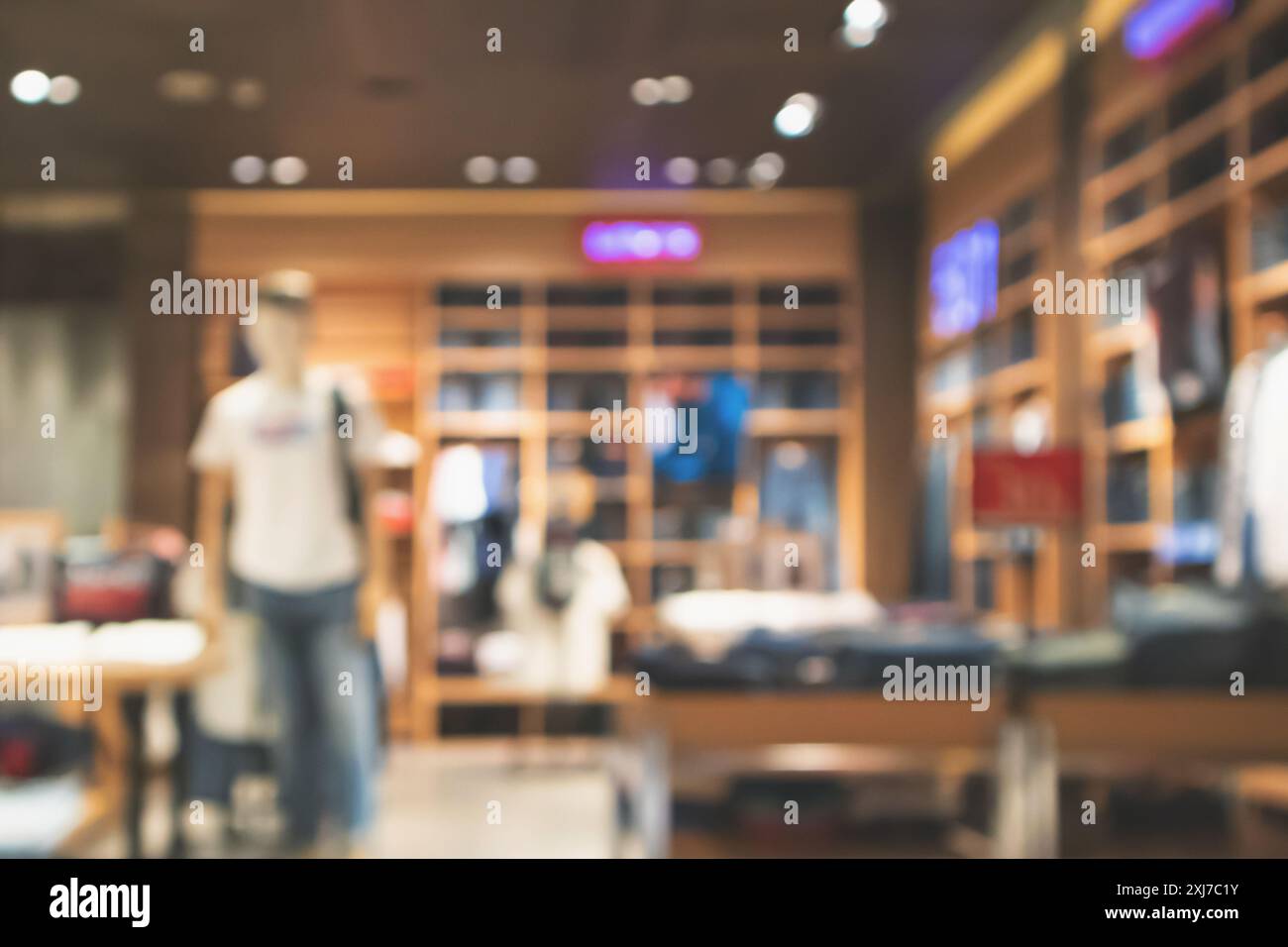 Abstract blur clothing store in modern shopping mall defocused ...