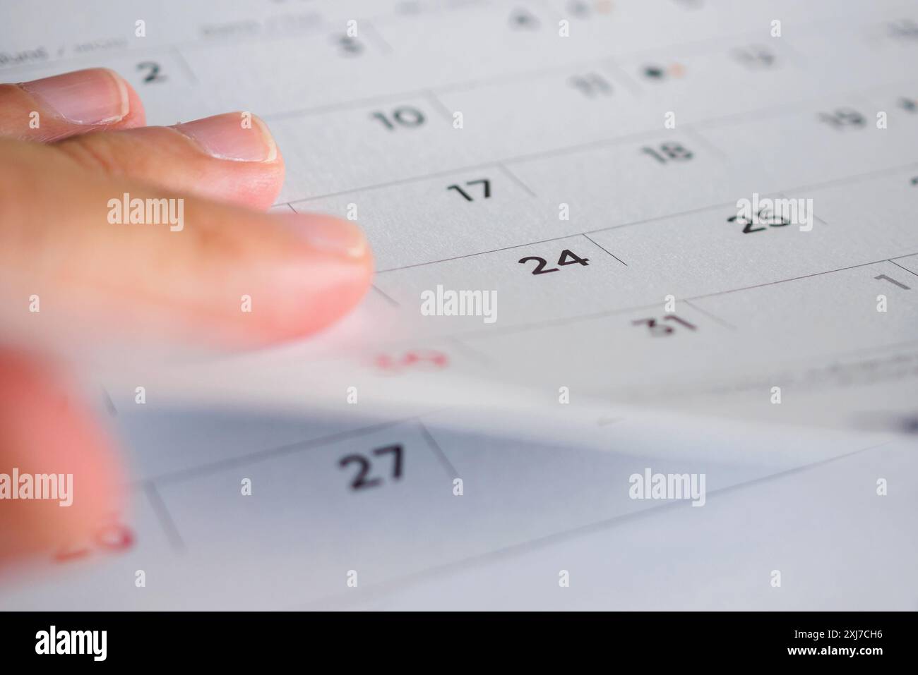 Hand hold calendar page flipping sheet close up background Stock Photo ...