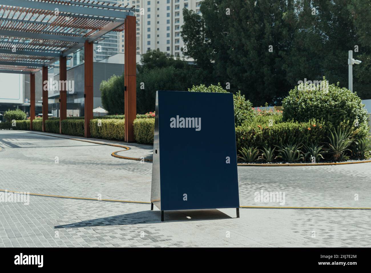 Blank signage board in urban park setting on the ground outside Stock ...