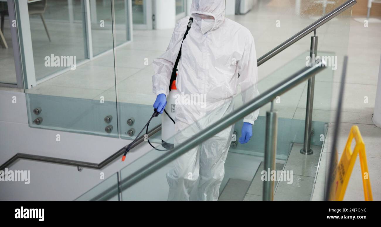 Cleaner, person and spray chemicals office for fumigation, disinfect ...