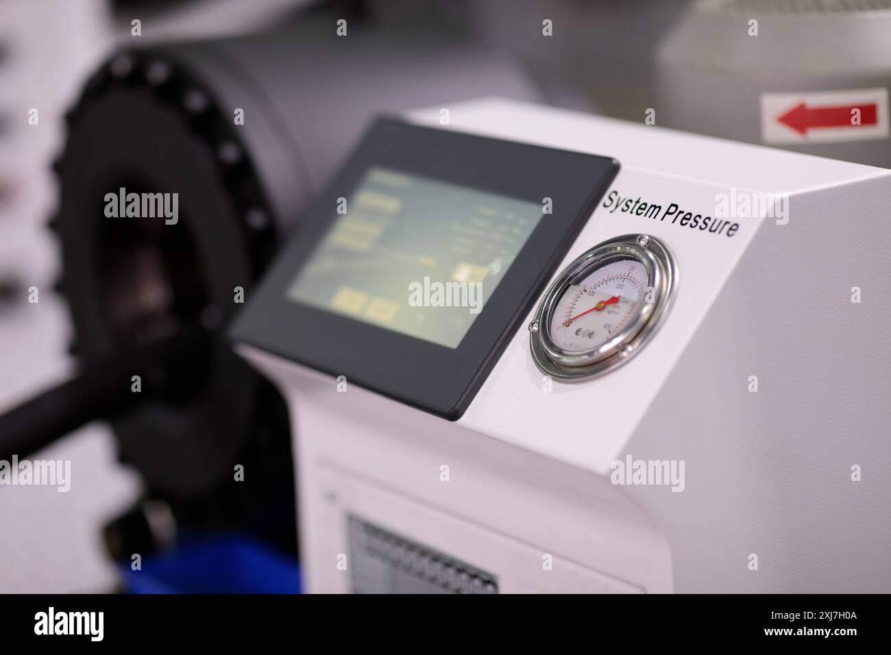 Modern industrial control console with touchscreen and pressure gauge ...