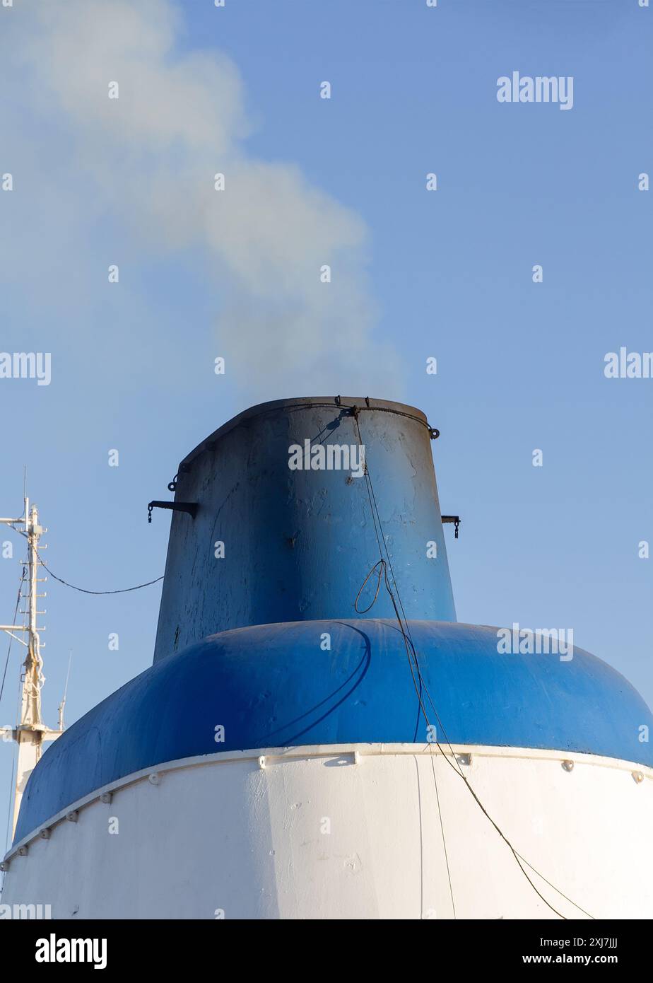 Smoke from chimney of a large passenger ship Stock Photo - Alamy