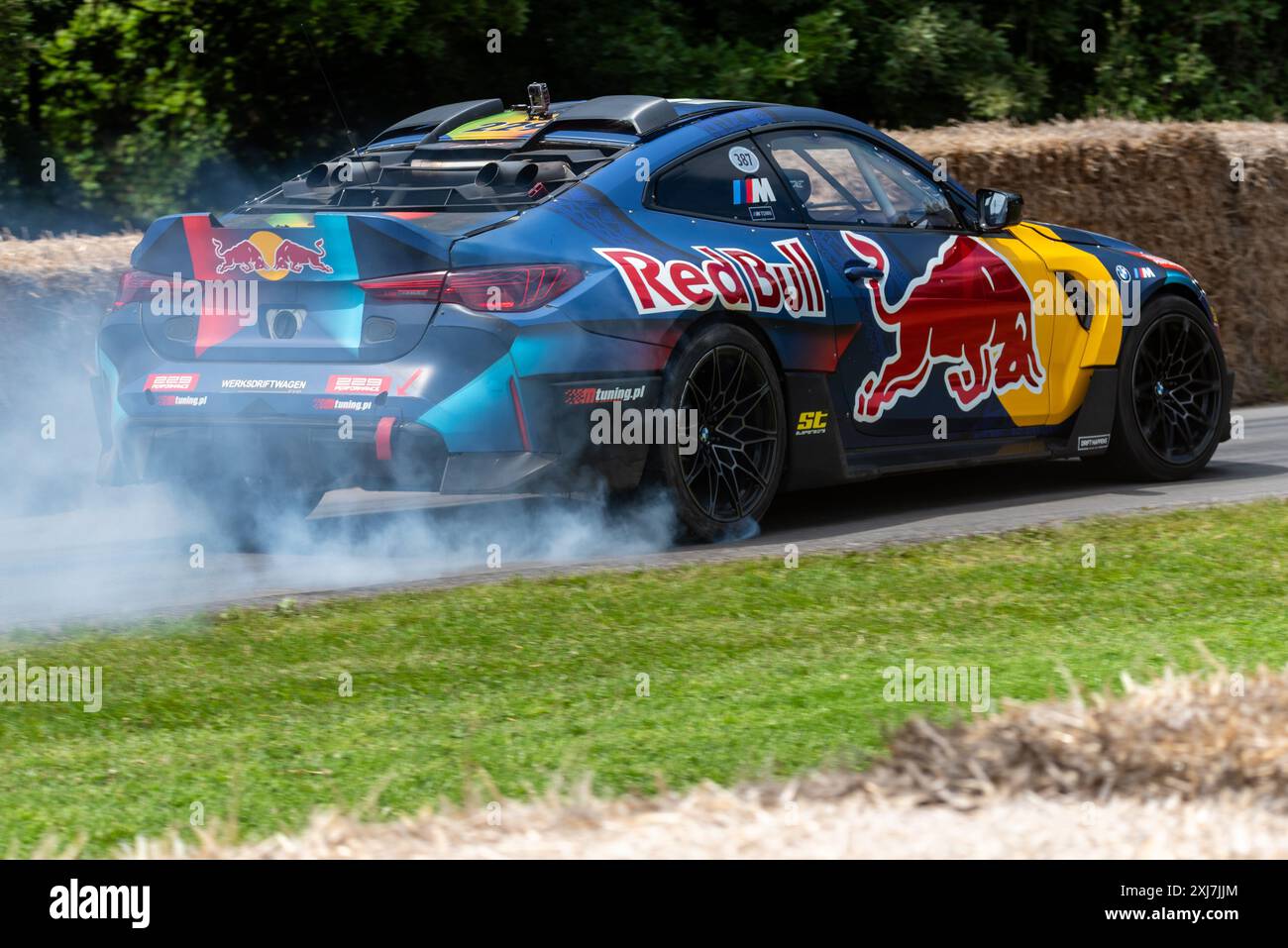 2024 BMW M4 G82 drift car driving up the hill climb track at the Goodwood Festival of Speed 2024 ...