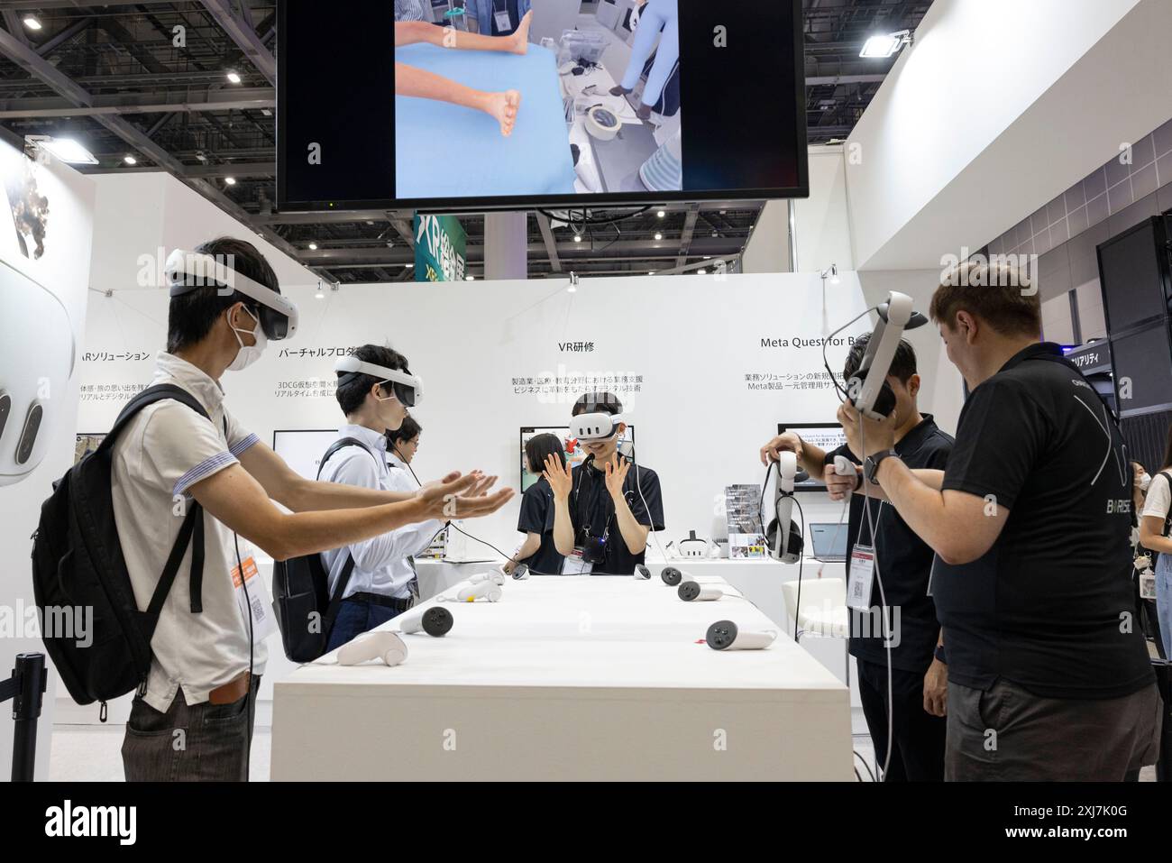 Tokyo, Japan. 04th July, 2024. Visitors of XR Fair Tokyo VR/AR/MR use a ...