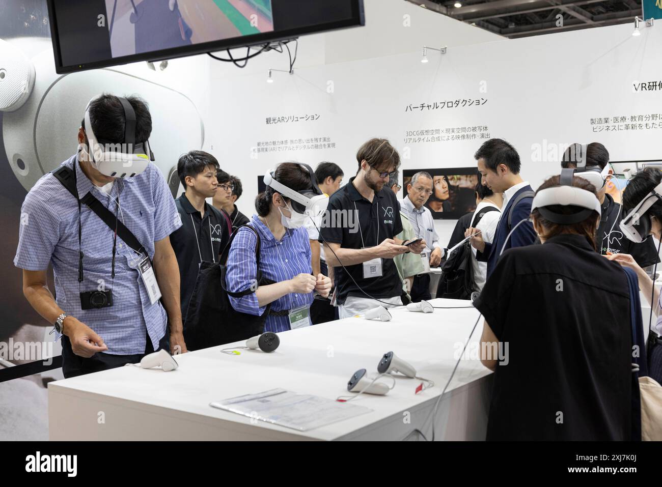 Tokyo, Japan. 04th July, 2024. Visitors of XR Fair Tokyo VR/AR/MR use a ...