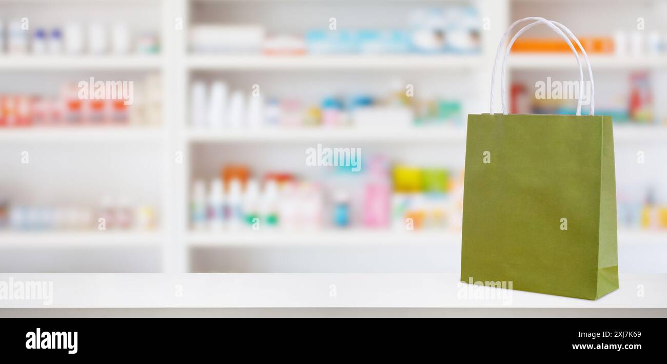 Paper bag on Pharmacy drugstore counter table with medicine and ...