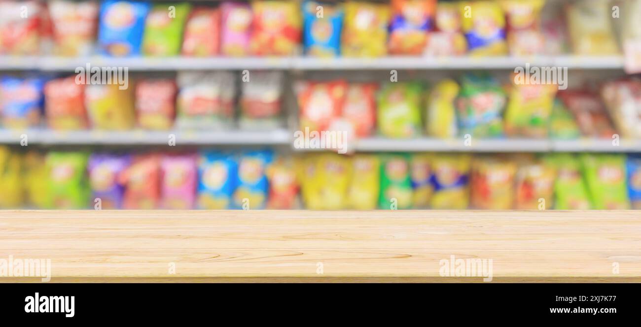 Wood table top with Supermarket convenience store shelves with Potato ...