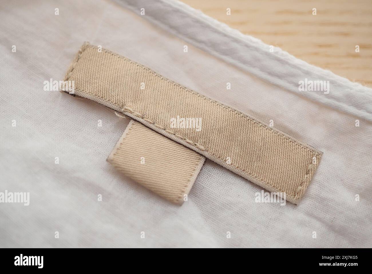 blank clothing label on fabric texture background Stock Photo - Alamy