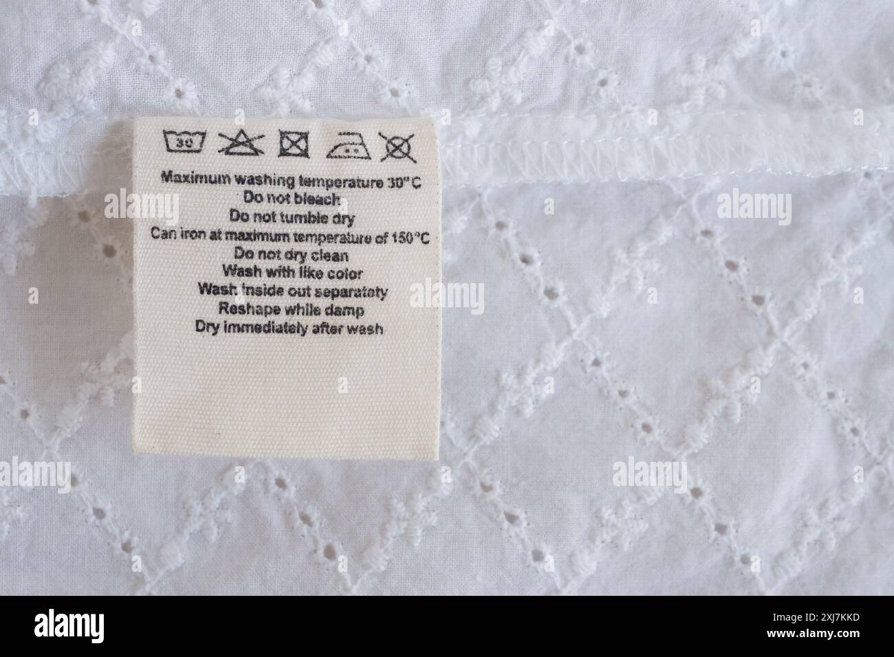 laundry care washing instructions clothes label on fabric texture ...