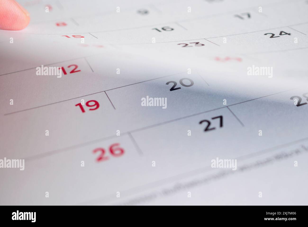 Hand hold calendar page flipping sheet close up background Stock Photo ...