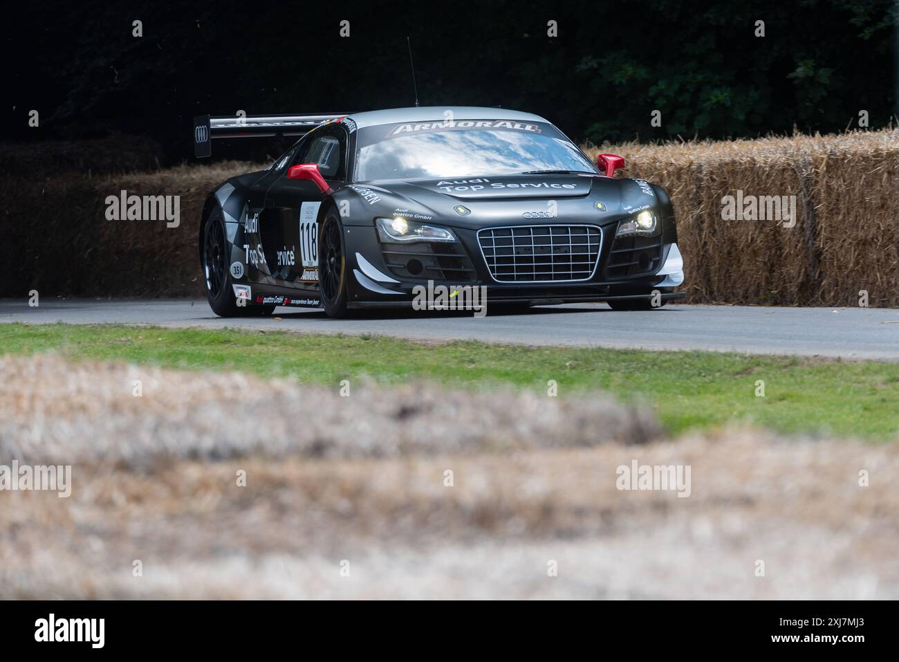 2010 Audi R8 LMS GT3 driving up the hill climb track at the Goodwood ...