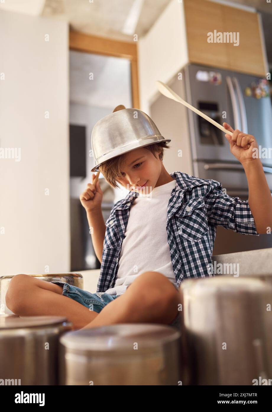 Child, ground and pots for drums in home for playing, entertainment and ...