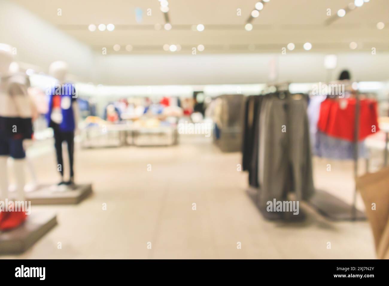 Abstract blur clothing boutique store display interior of shopping mall ...