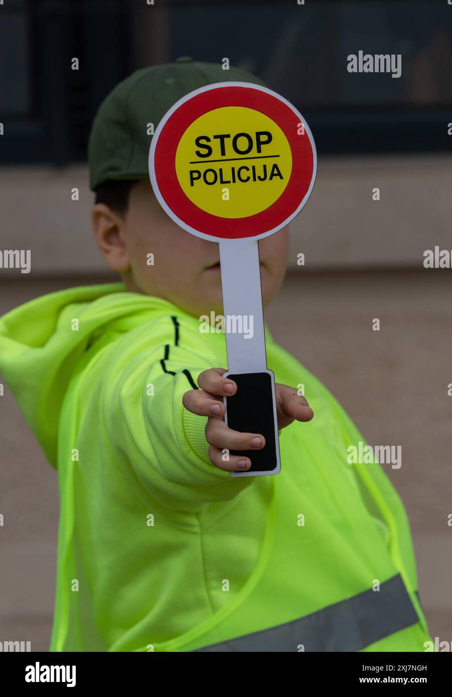 Young boy enjoys playing traffic police officer as part growing process ...