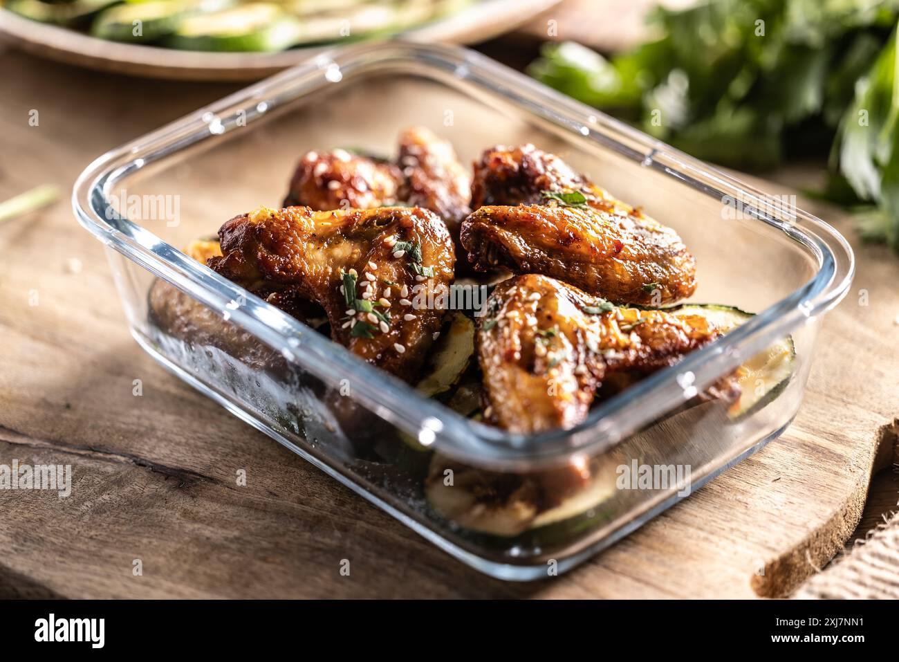 Grilled chicken wings in a glass bowl, ready to eat later Stock Photo ...