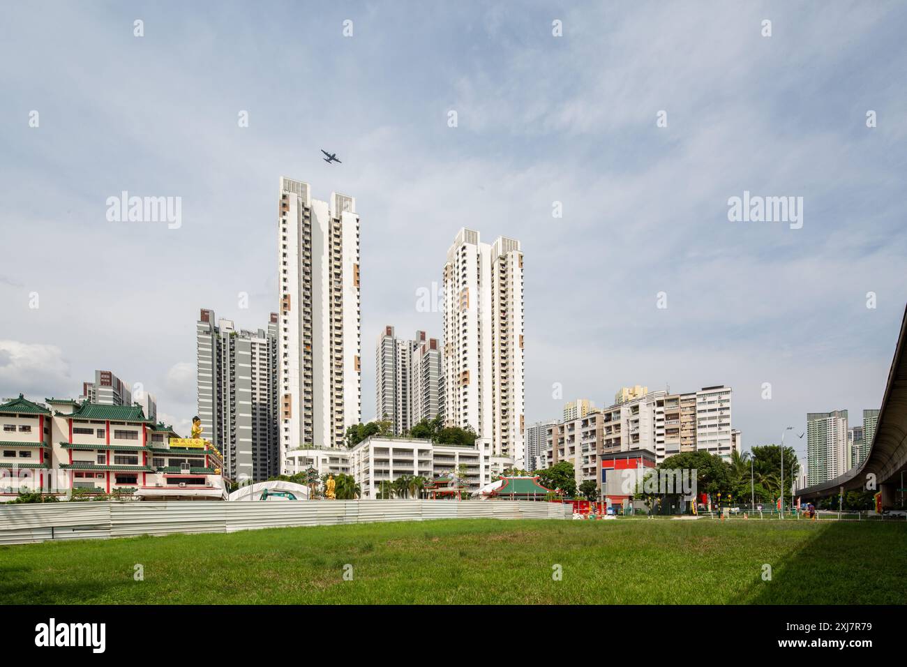An aircraft is flying over housing estate neighbourhood area. Clementi ...