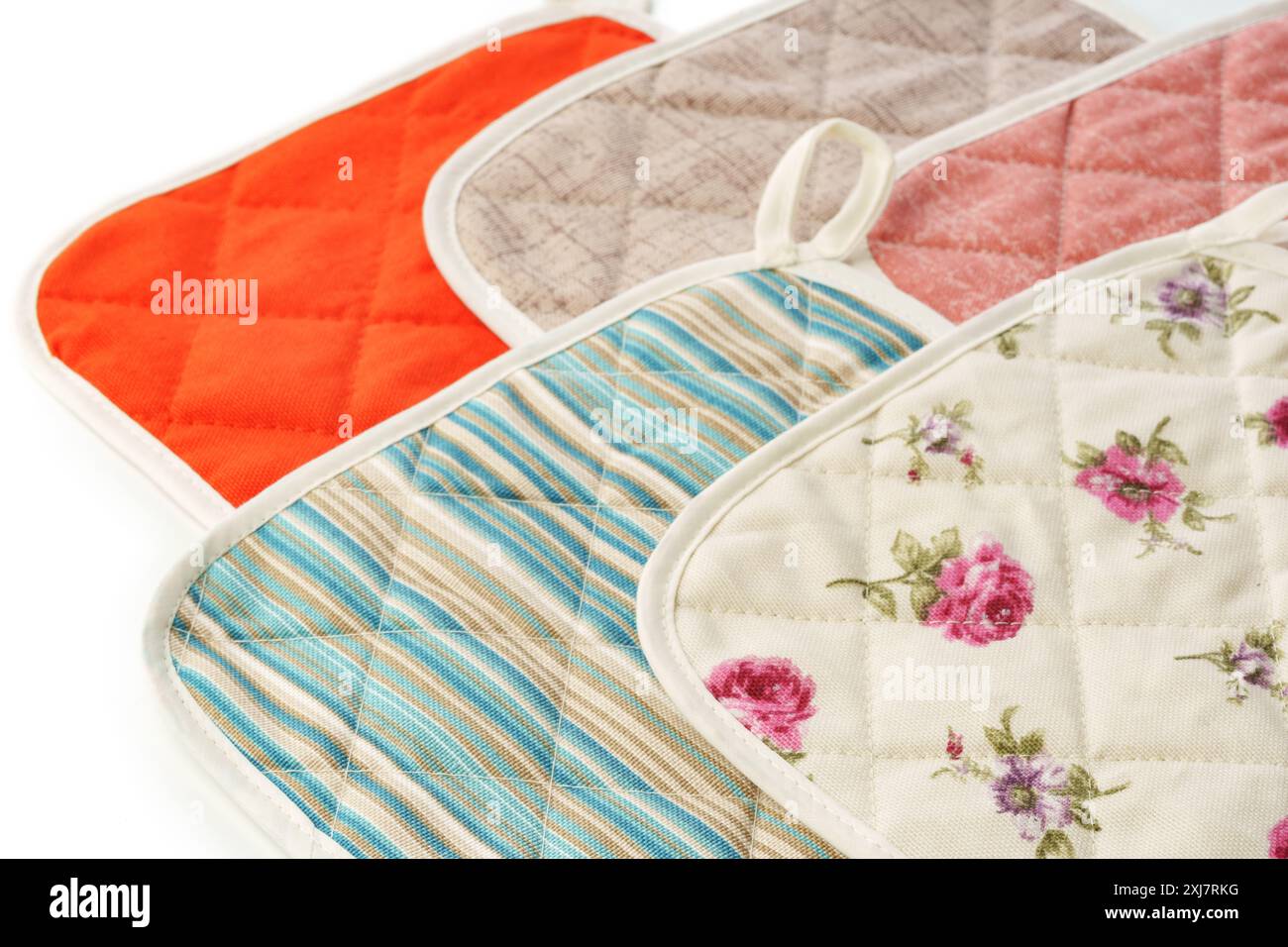 Quilted Cotton Pot Holders With Floral and Striped Patterns Stock Photo ...
