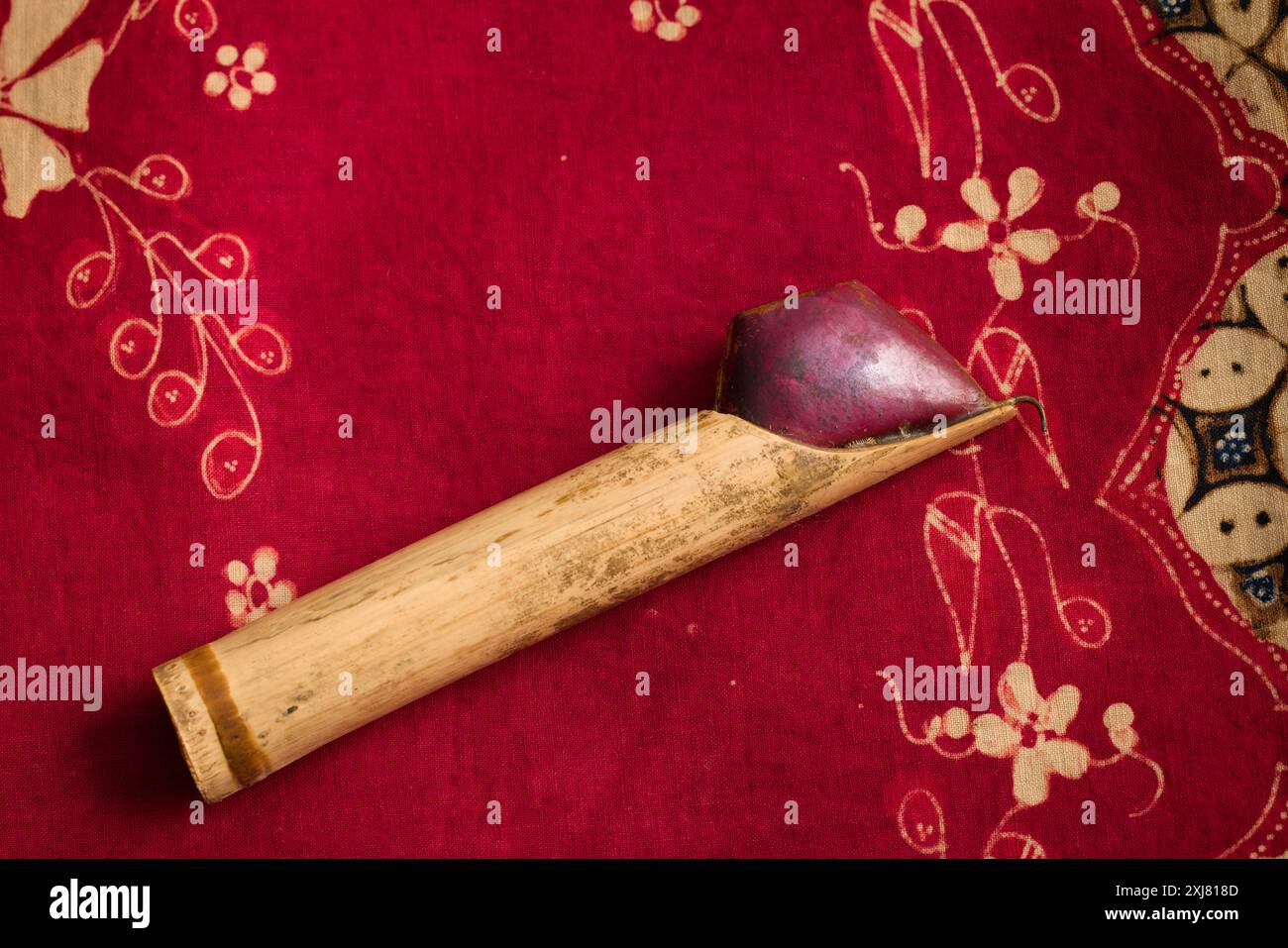 Batik fabrics are made with the use of a canting and hot wax, which is ...