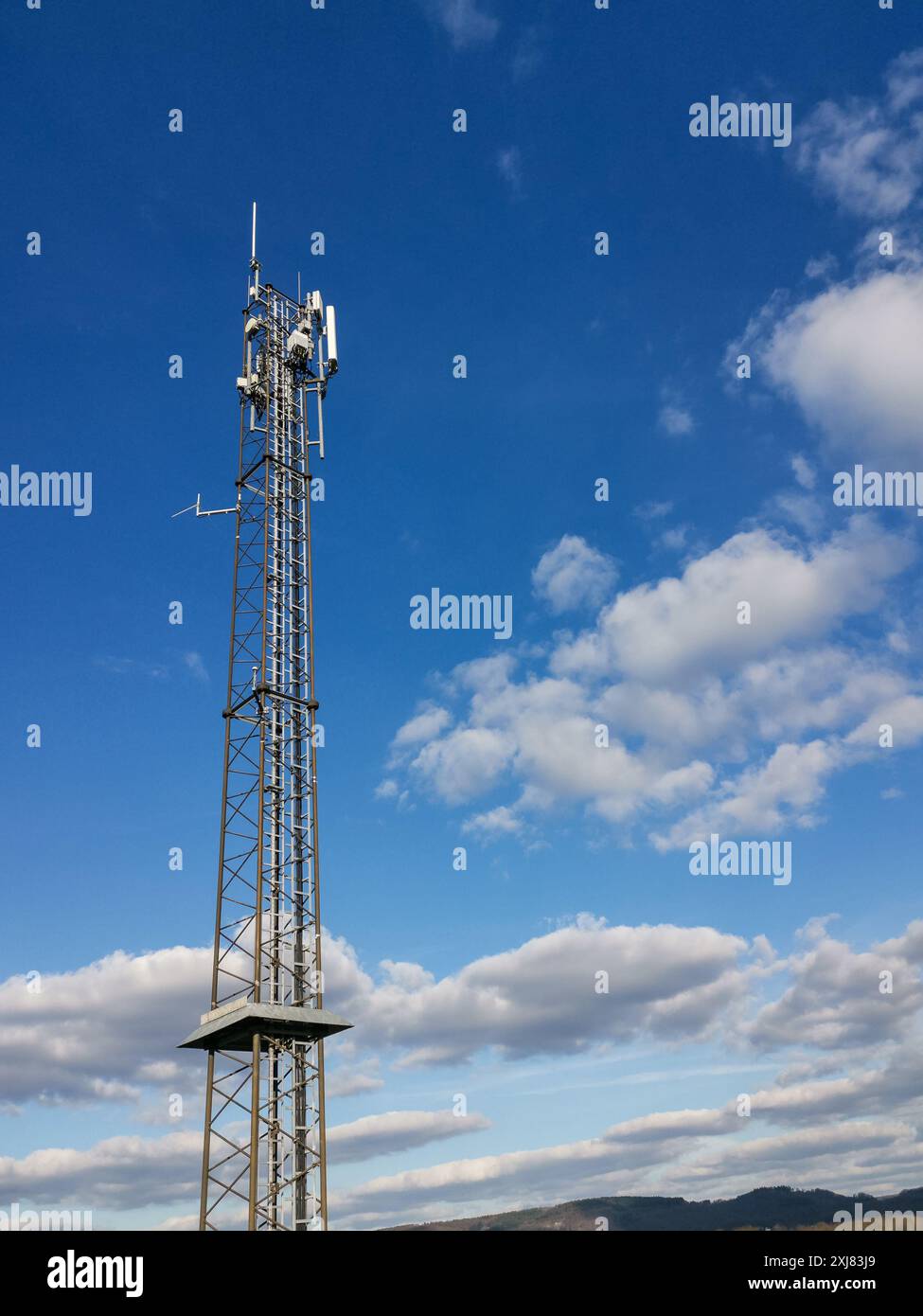 A telecommunication tower with different kinds of antennas on top ...