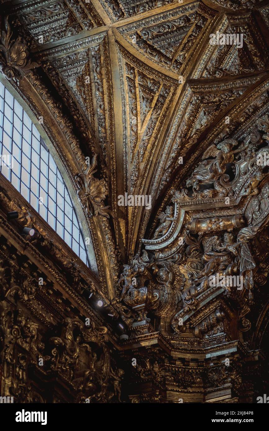 A close up of a carved wooden ceiling with a window, an architectural ...