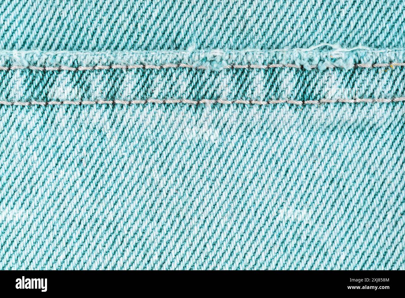 Turquoise denim jeans pants cloth with seam, close up, macro. Fabric ...