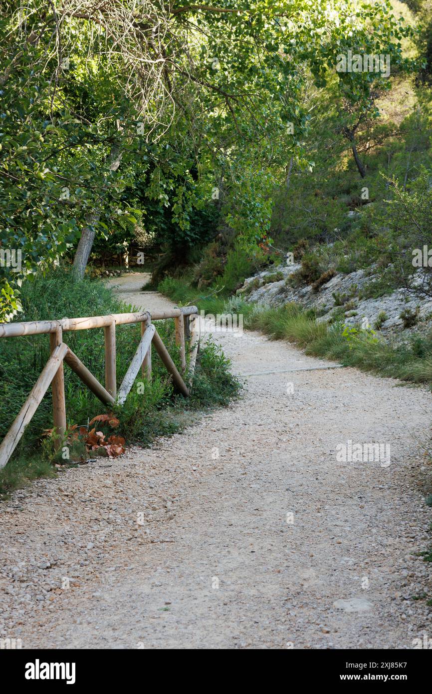 Path with wooden railing to access the Font Hortet del Pobre ...