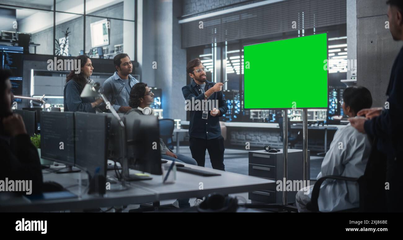 Group of Multiethnic Software Developers Having a Meeting in a Conference Room with Green Screen ...