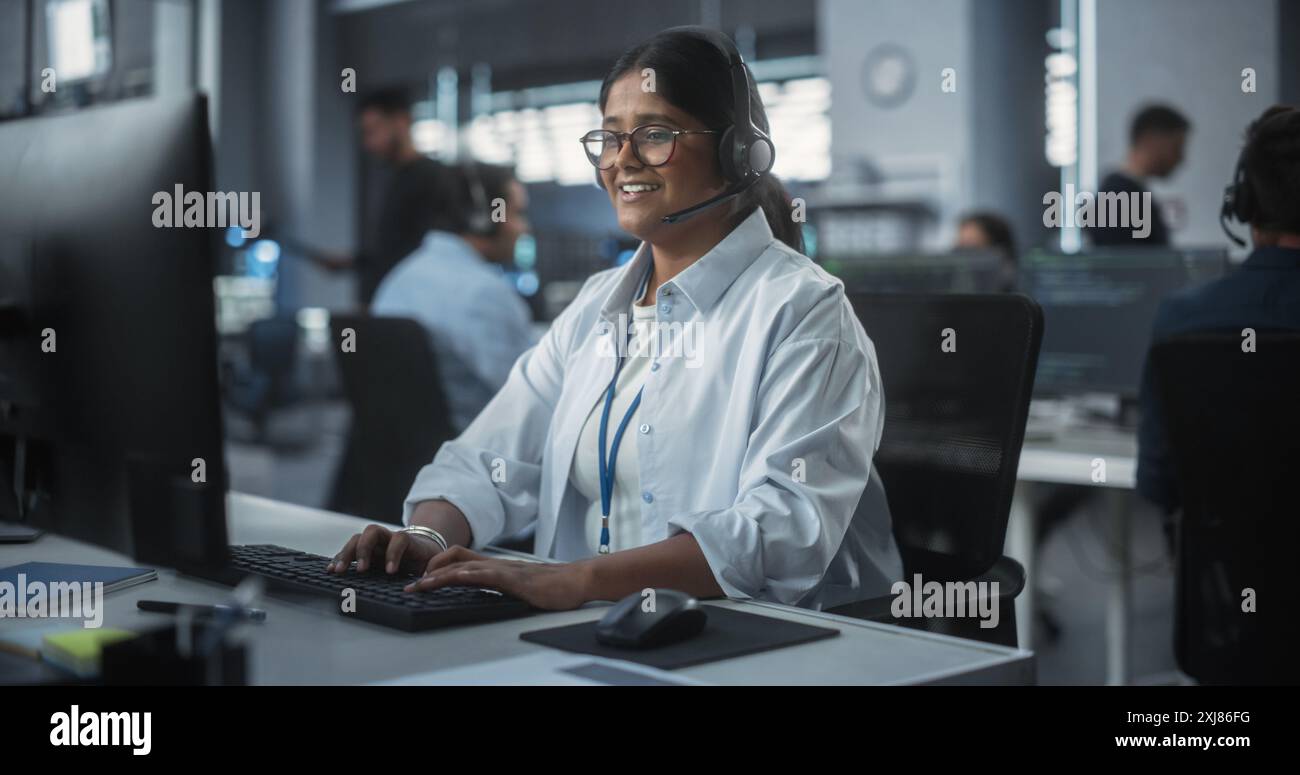 Customer Support Professional Using Computer and Talking with Client on ...