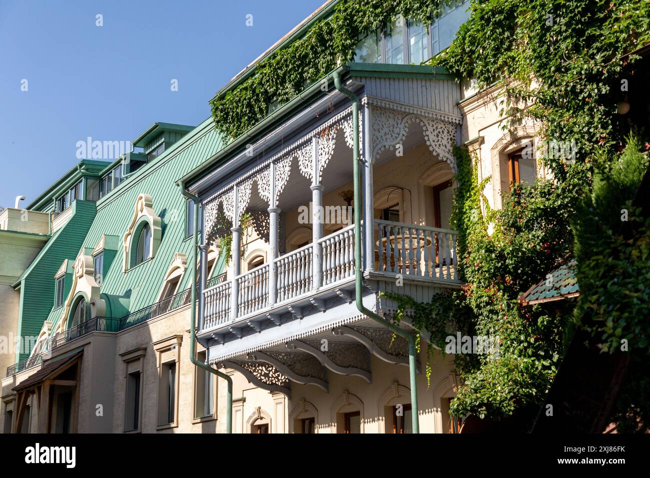 Tbilisi, Georgia - 24 JUNE, 2024: Traditional ornamental oriel windows ...