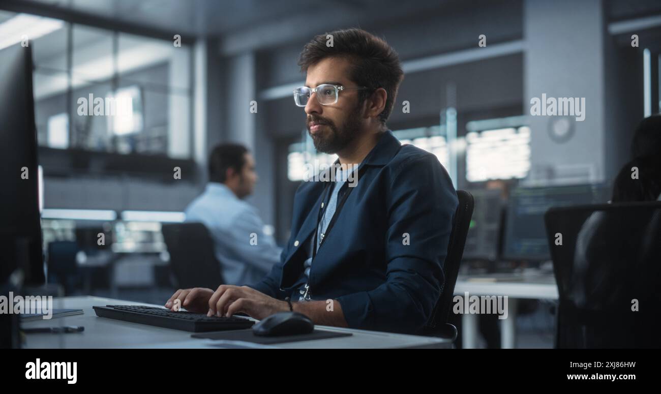 Portrait of an Indian Engineer Working on Desktop Computer in a ...