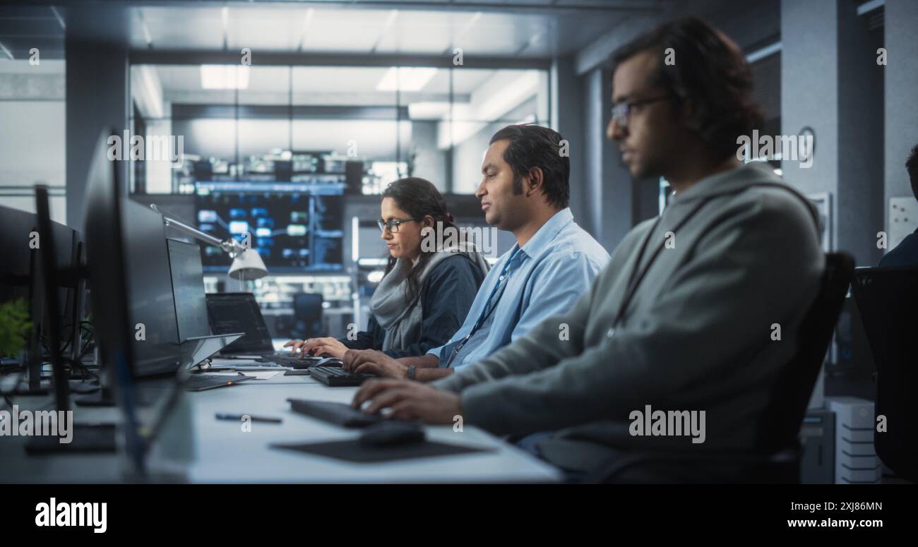 Team of Talented Young Indian Professionals Working in a Technological ...