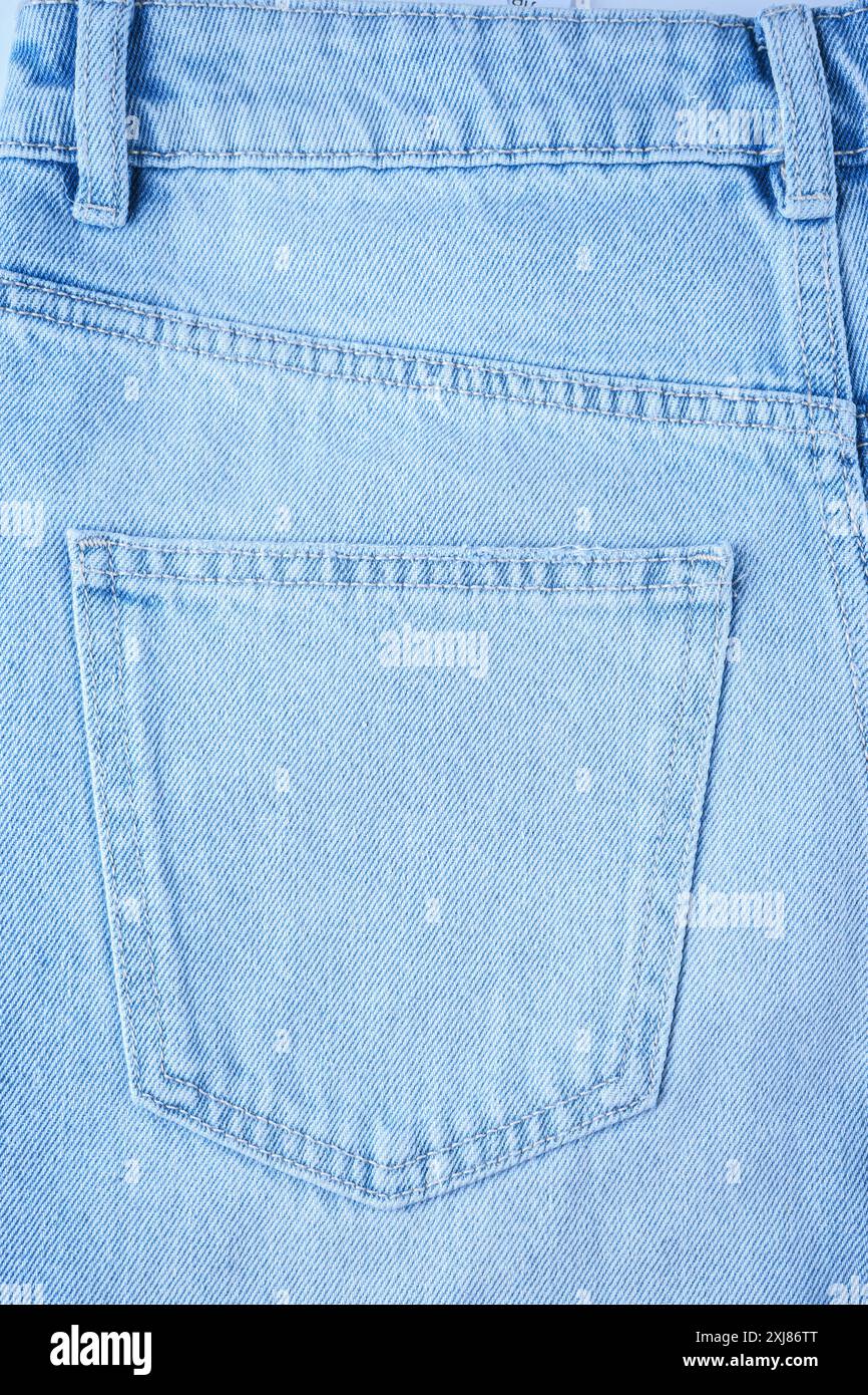 Back side pocket of blue jeans pants closeup. Denim background, texture ...