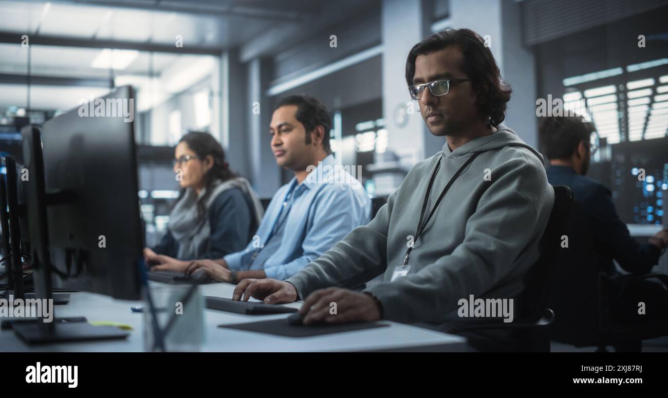 Group of Multicultural South Asian Men and Women Working in a Research ...