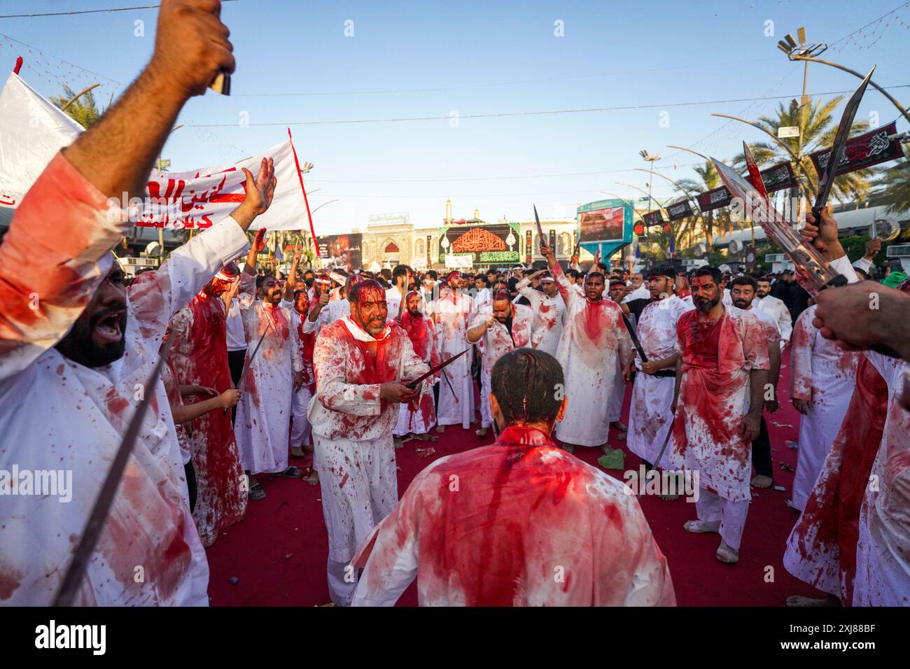 Iraqi Shiites mark the month of Muharram in Karbala, Iraq, on Wednesday ...