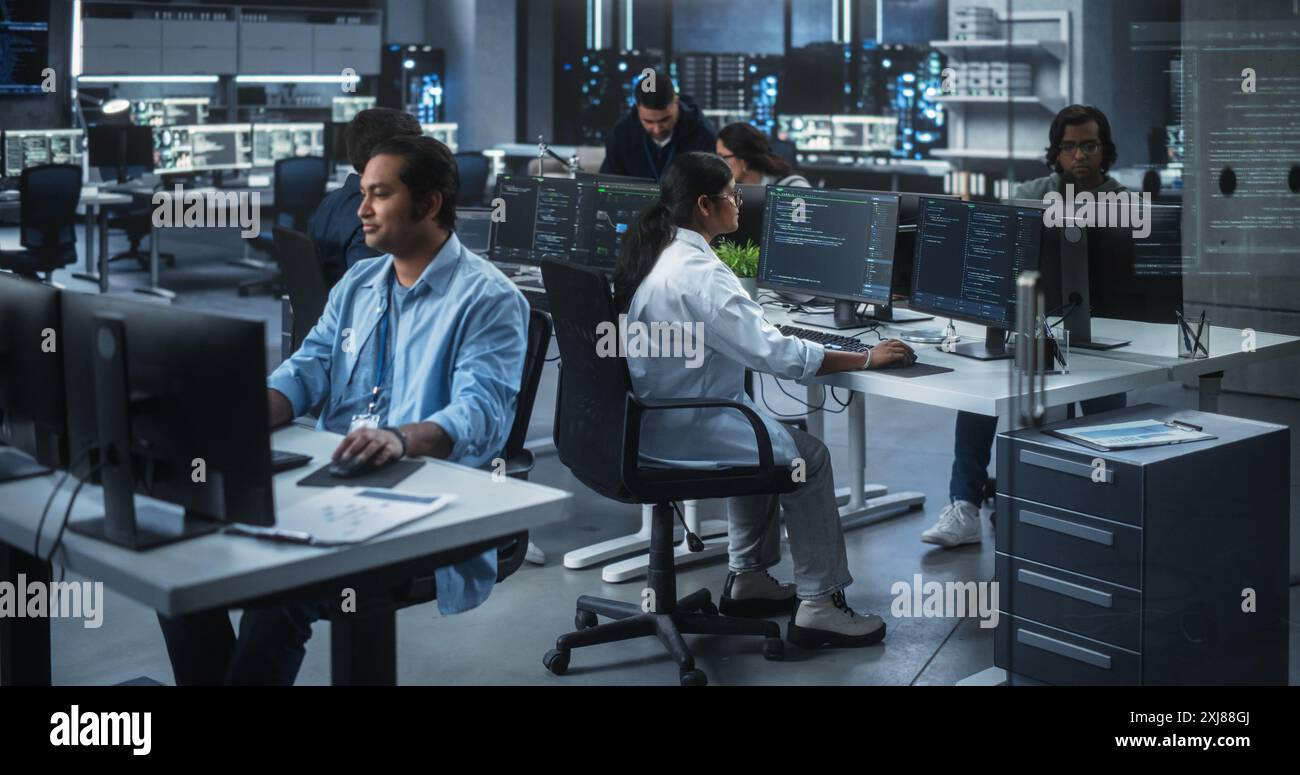 Team of Talented Young Indian Professionals Working in a Technological ...