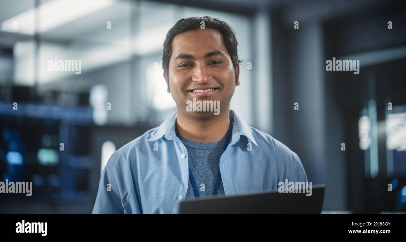 Handsome Smiling IT Specialist Using Laptop Computer in Data Center ...
