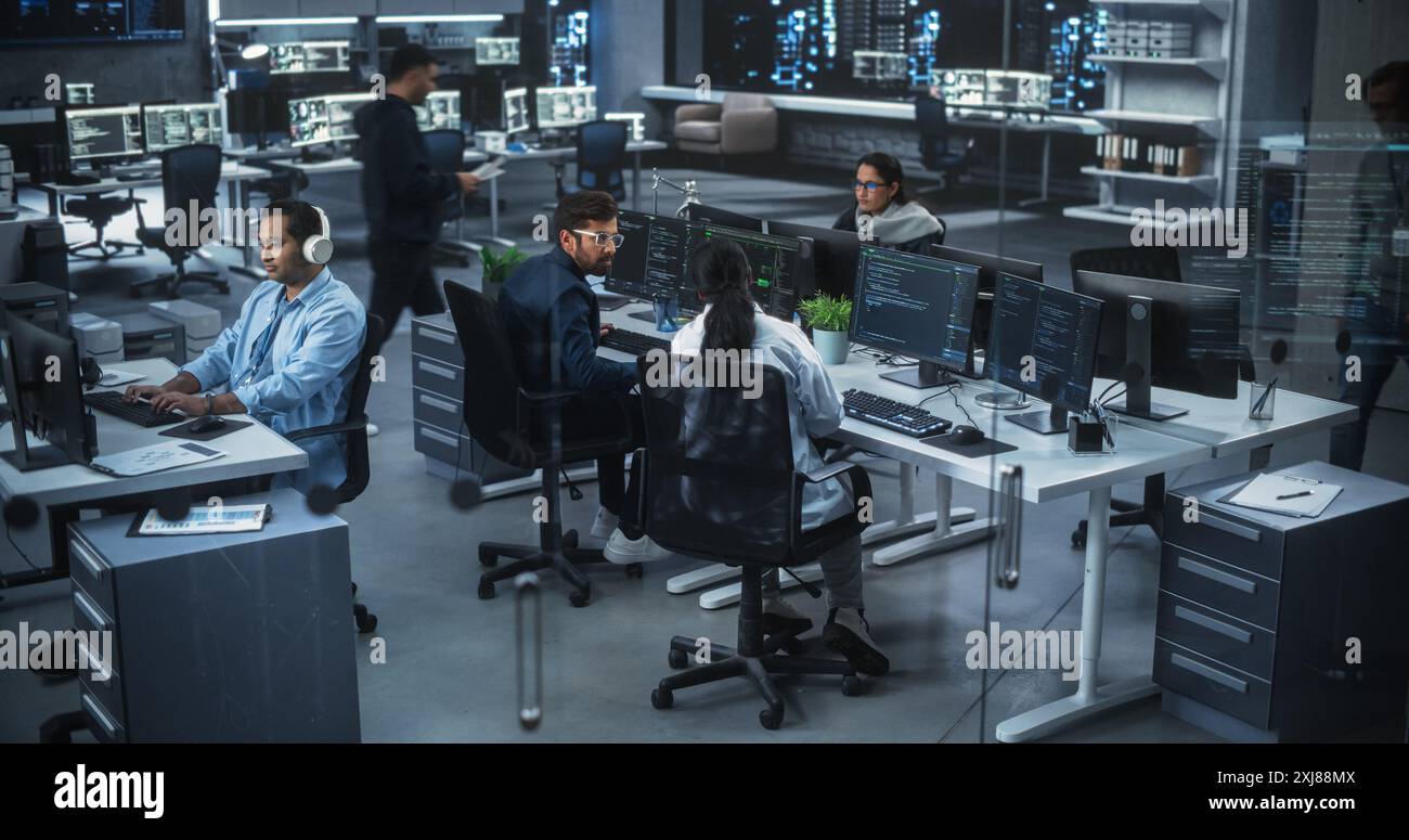 Team of Talented Young Indian Professionals Working in a Technological ...