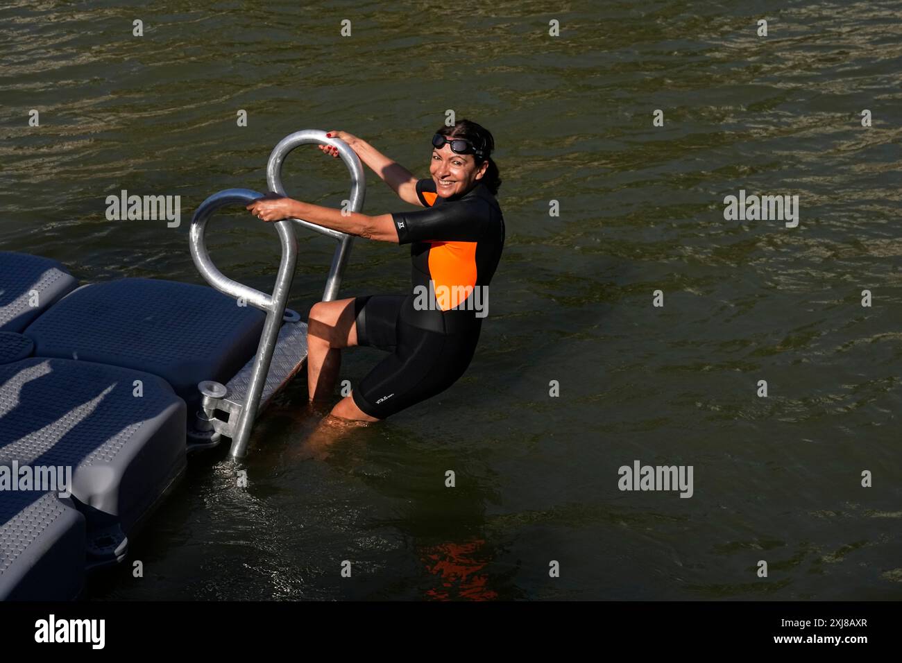 Paris Mayor Anne Hidalgo enters the Seine river Wednesday, July 17 ...