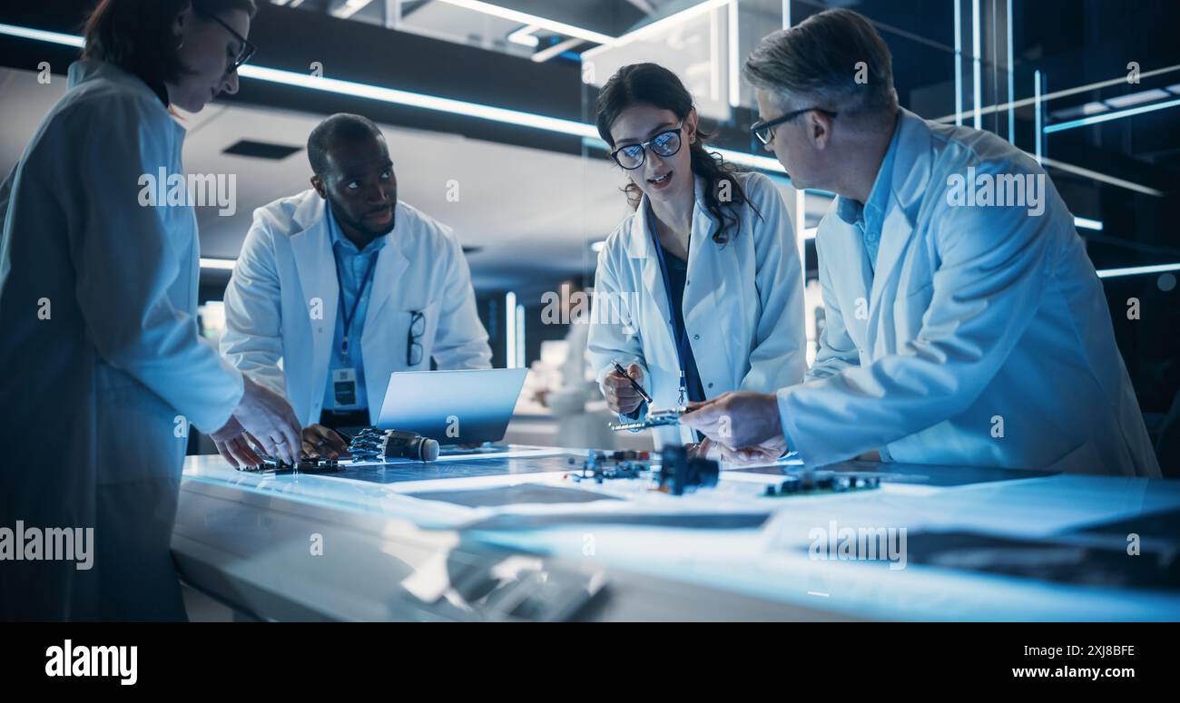 Robotics engineers working humanoid robot hi-res stock photography and ...