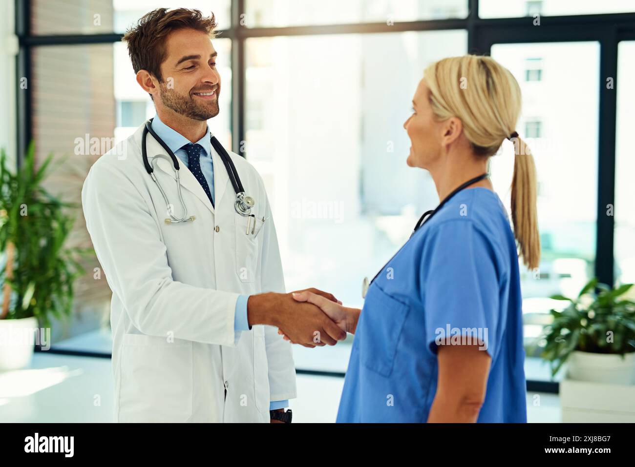 Healthcare, handshake and medical team in hospital for welcome, support ...