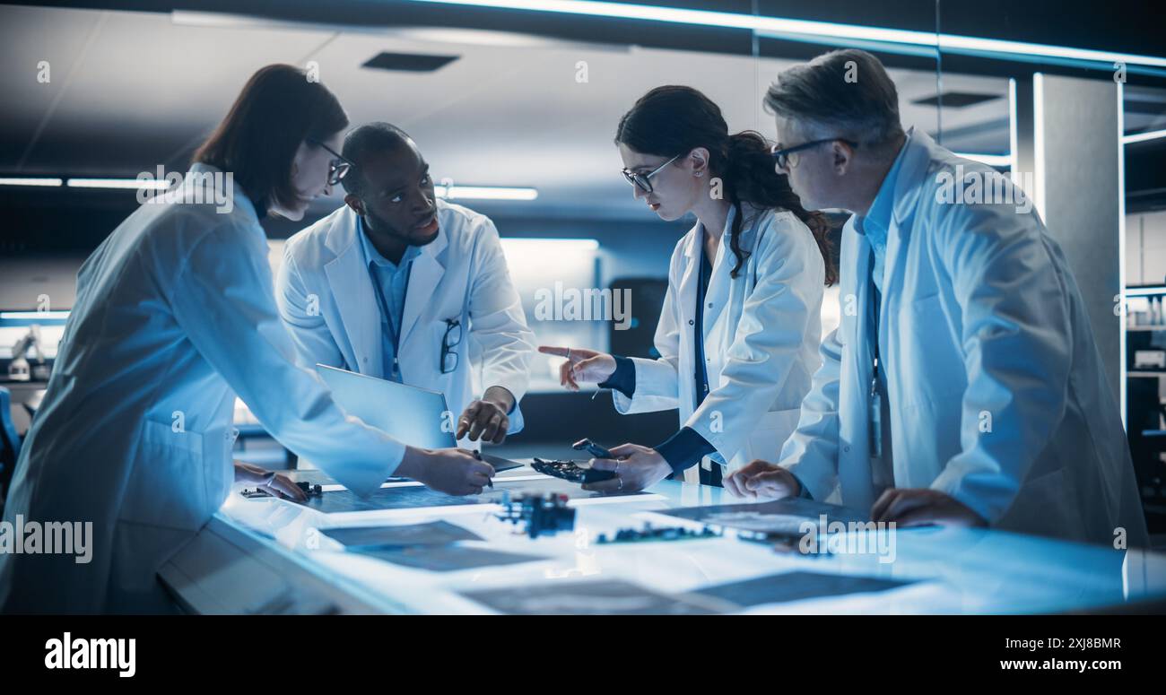 Robotics engineers working humanoid robot hi-res stock photography and ...