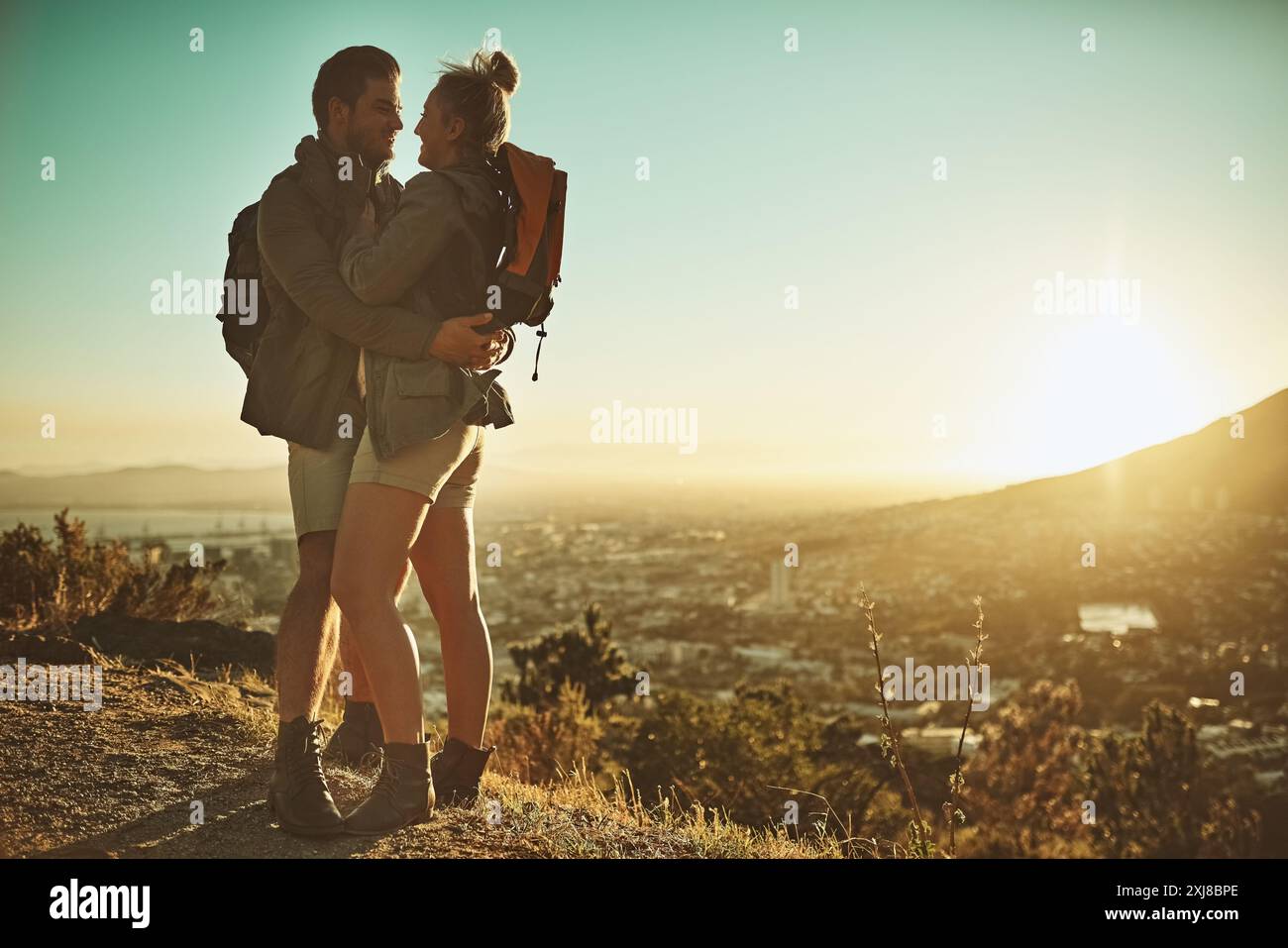 Hiking, couple and love on mountain top for travel, adventure and ...