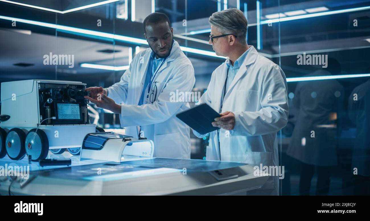 Robotics lab two engineers in hi-res stock photography and images - Alamy