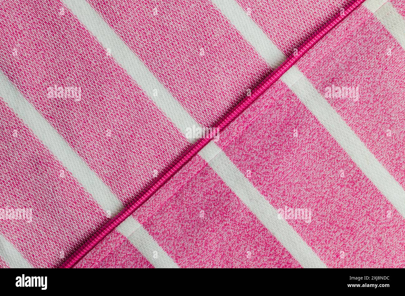 Closeup view of zip hoodie fabric texture. Pink zip hoodie fabric with ...