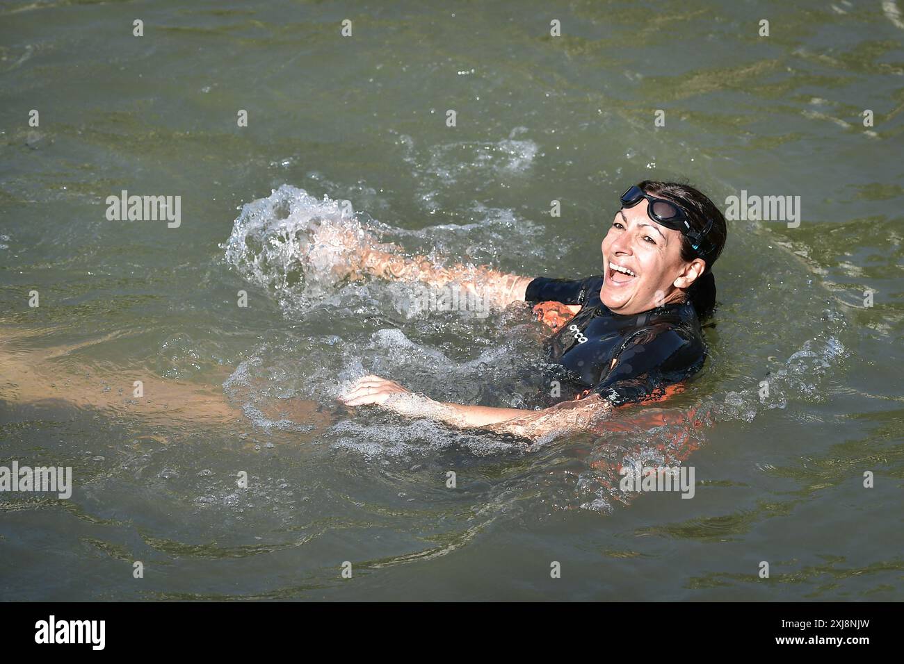 Paris, France. 17th July, 2024. Mayor of Paris Anne Hidalgo swims in ...