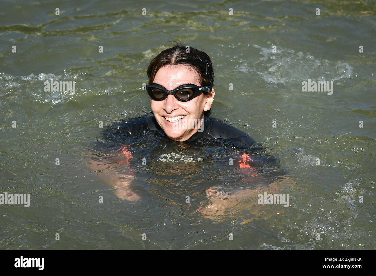 Paris, France. 17th July, 2024. Mayor of Paris Anne Hidalgo swims in ...
