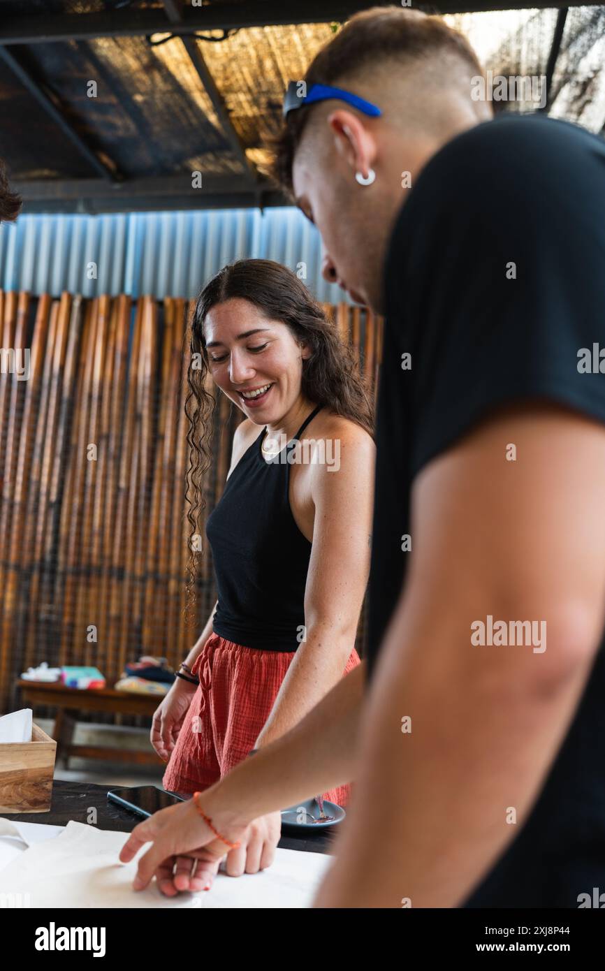 Two friends laughing during a summer acrylic painting workshop ...