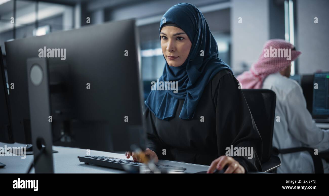 Young Arab Female Artificial Intelligence Engineer Working on Computer ...